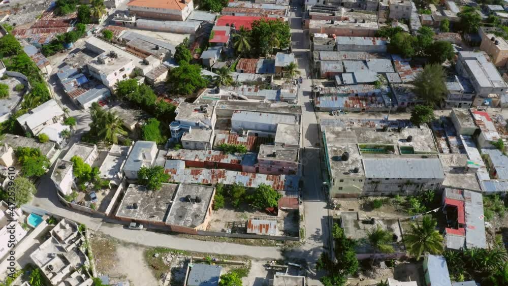 Miserable buildings on dirty beggar streets. People are forced to live ...