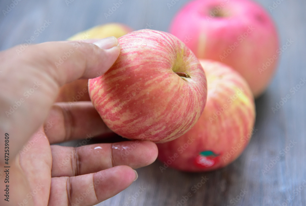 Fuji apples are moderately sized fruits, and have a round to ovate ...