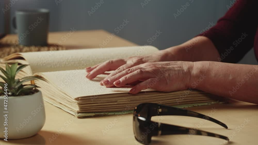 Blind woman reading braille book using fingers close-up, poorly seeing ...