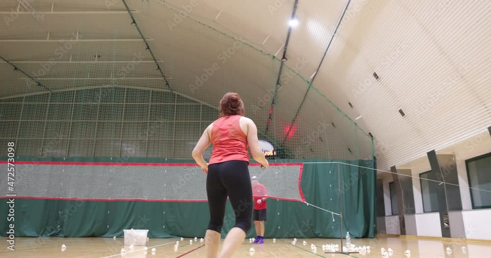 Badminton players on court for sport activity, indoor. On a badminton ...