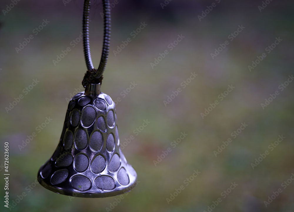 Silver bell on botanical green background. Template for an inscription ...