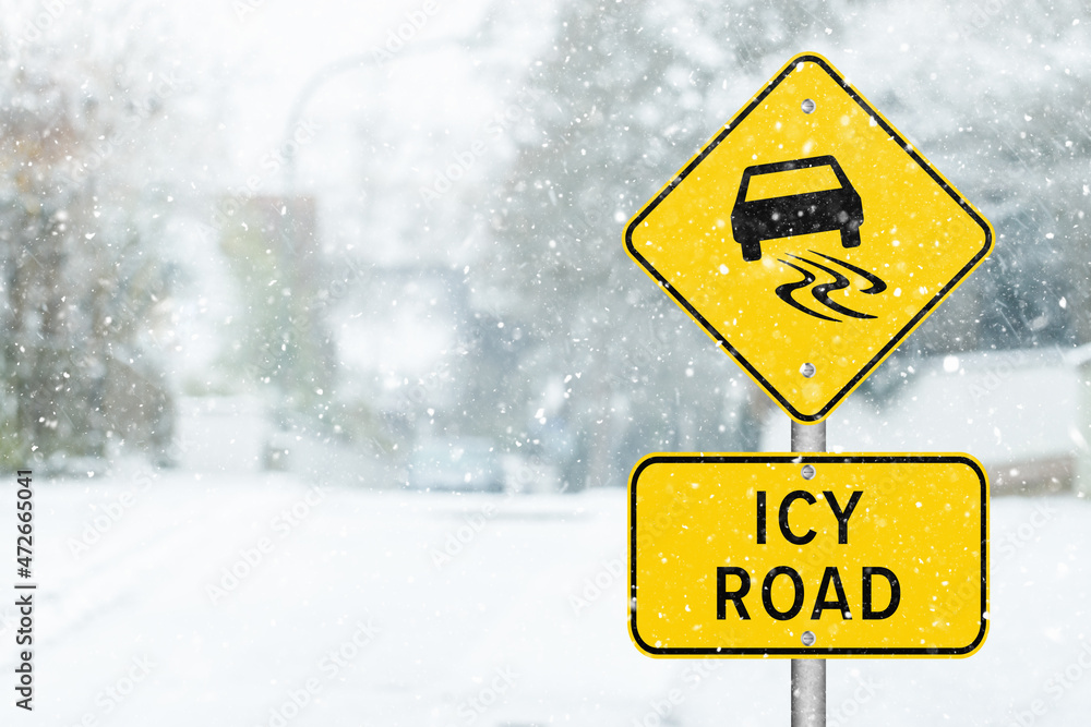 Traffic Sign with car icon and text "Icy Road" on a snowy background ...