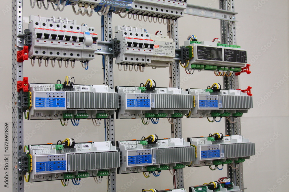 Lutron modules for voltage dimming are connected by a mounting wire and ...