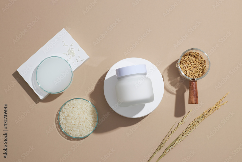 wheat and rice extract in petri dish purple background with cosmetic ...