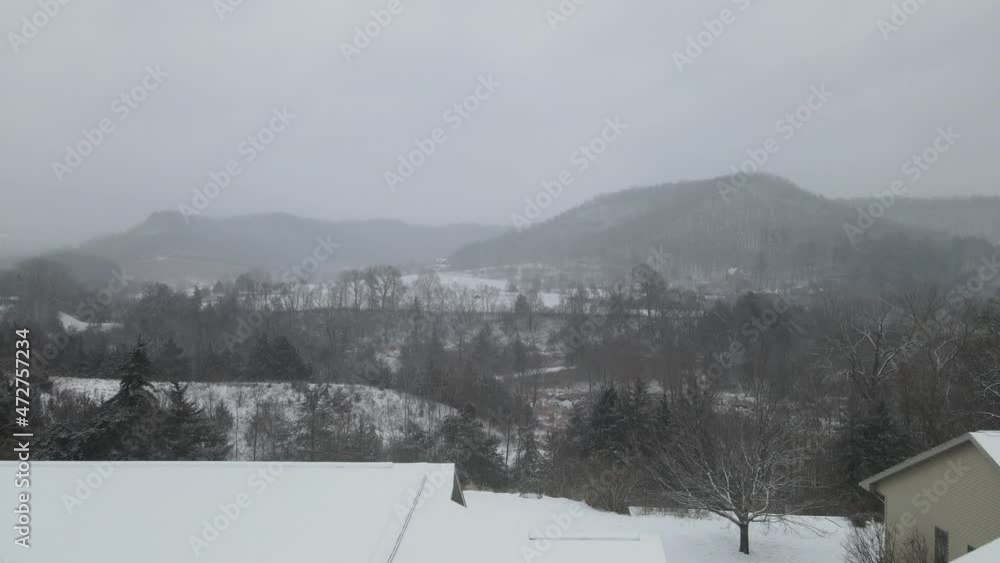 Snow over rural landscape valley in Wisconsin. Dips and curves of ...