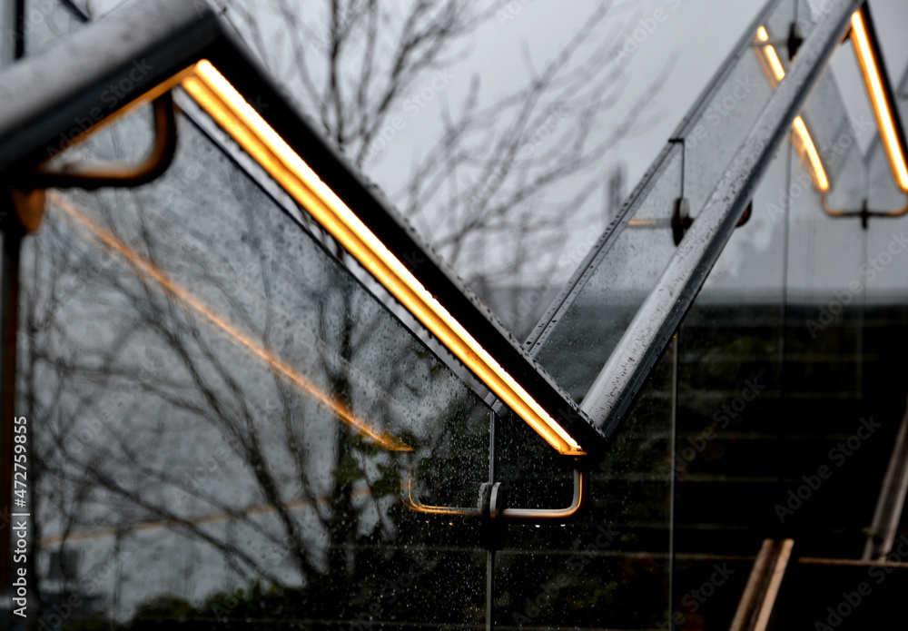 from the bottom of the handle is a recessed LED strip with a yellow ...