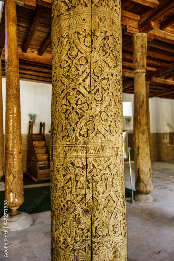 Close-up view of one of wooden columns in Juma Mosque, Khiva ...