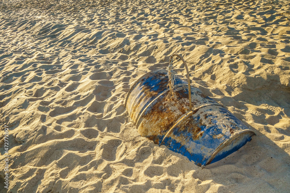Barrel from a ship, once thrown overboard and remaining forever buried ...