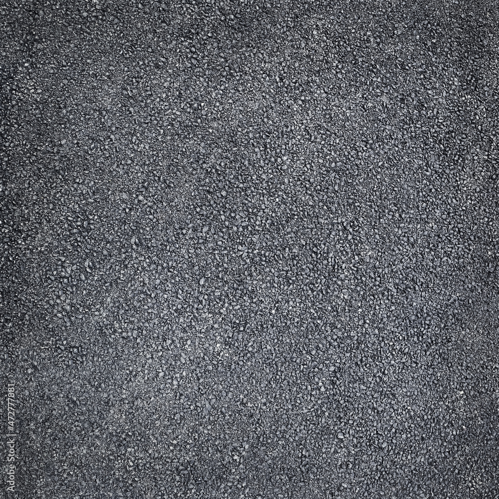 Black colored granulated material texture asphalt close up top view ...