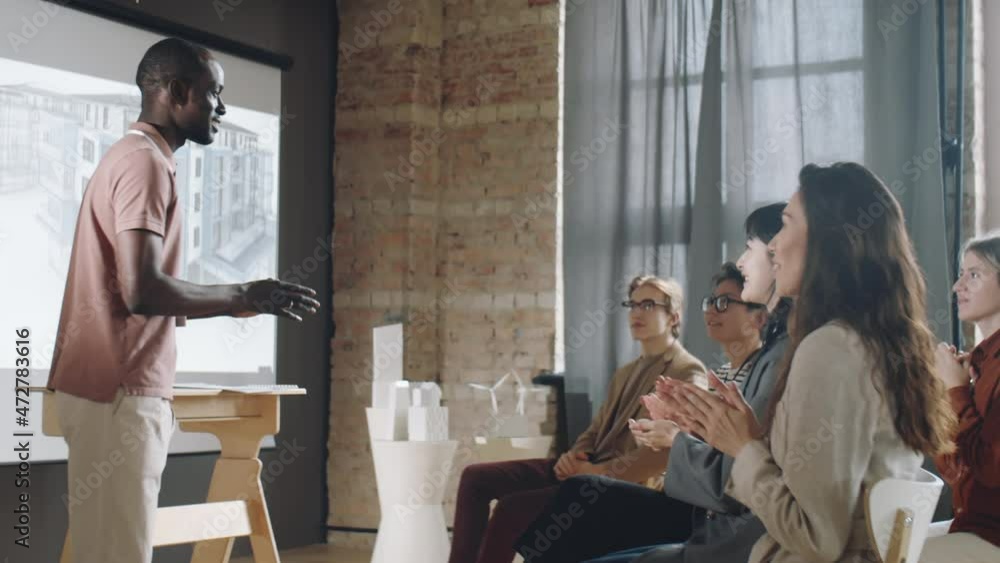 African American architect thanking audience after presentation and ...