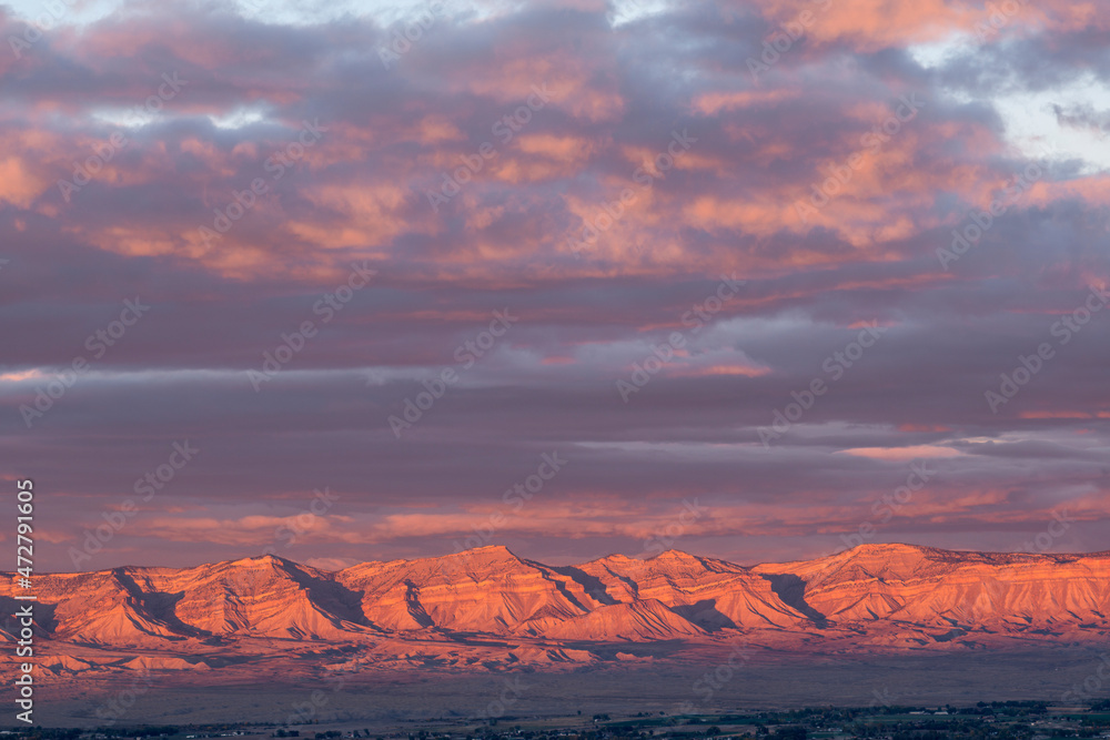 USA, Colorado. Sunset sky over Book Cliffs and town of Fruita, view ...