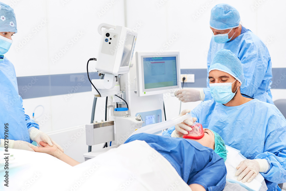 Medical team controls and monitors patient's anesthesia Stock Photo ...