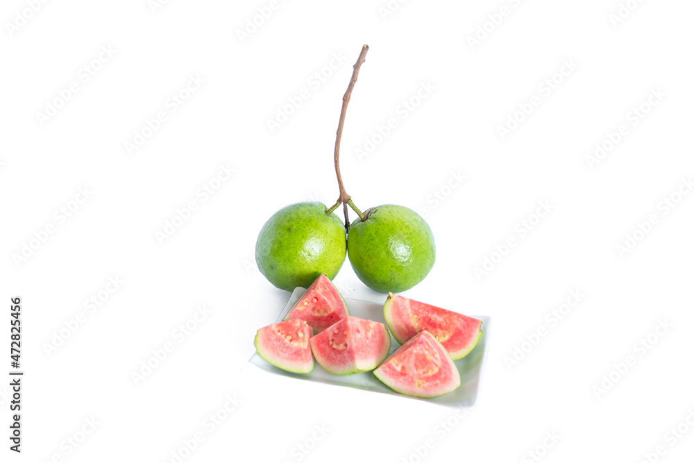 two Common guava and r Common guava cut into small pieces and served on ...