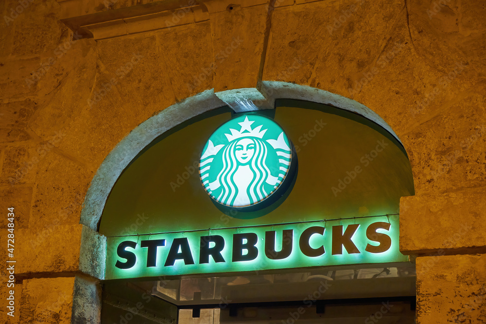 Starbucks signboard logo at the facade entrance to store in downtown ...