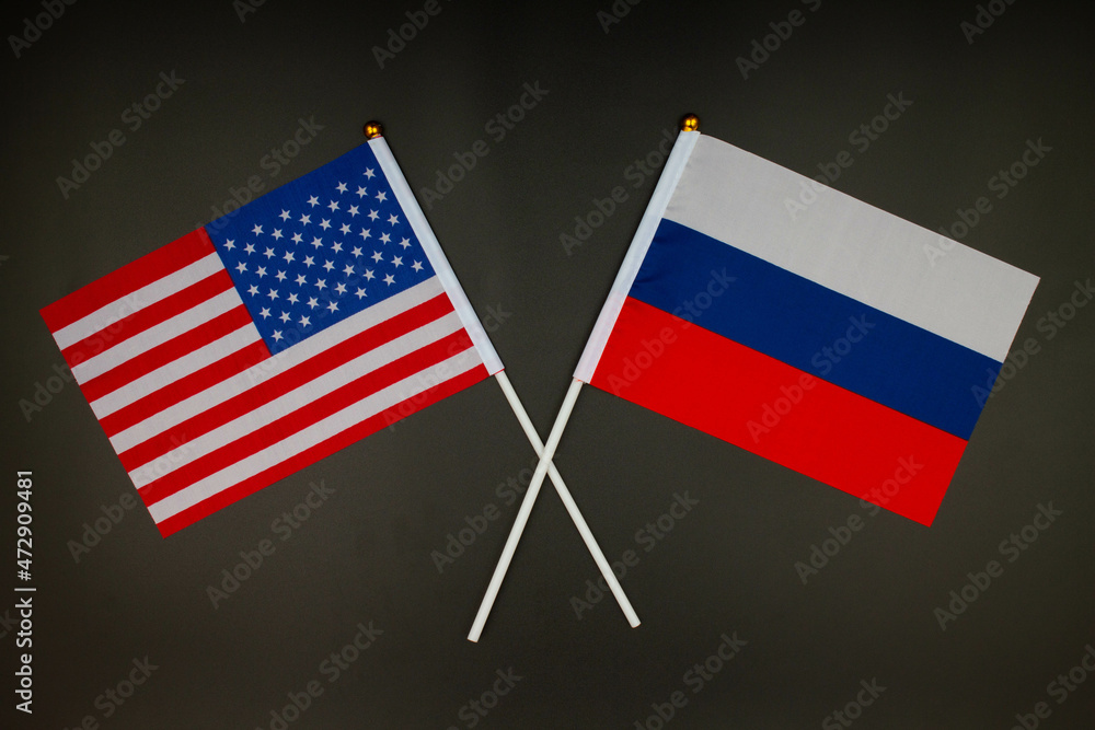 USA flag and Russia flag crossed with each other on the black ...