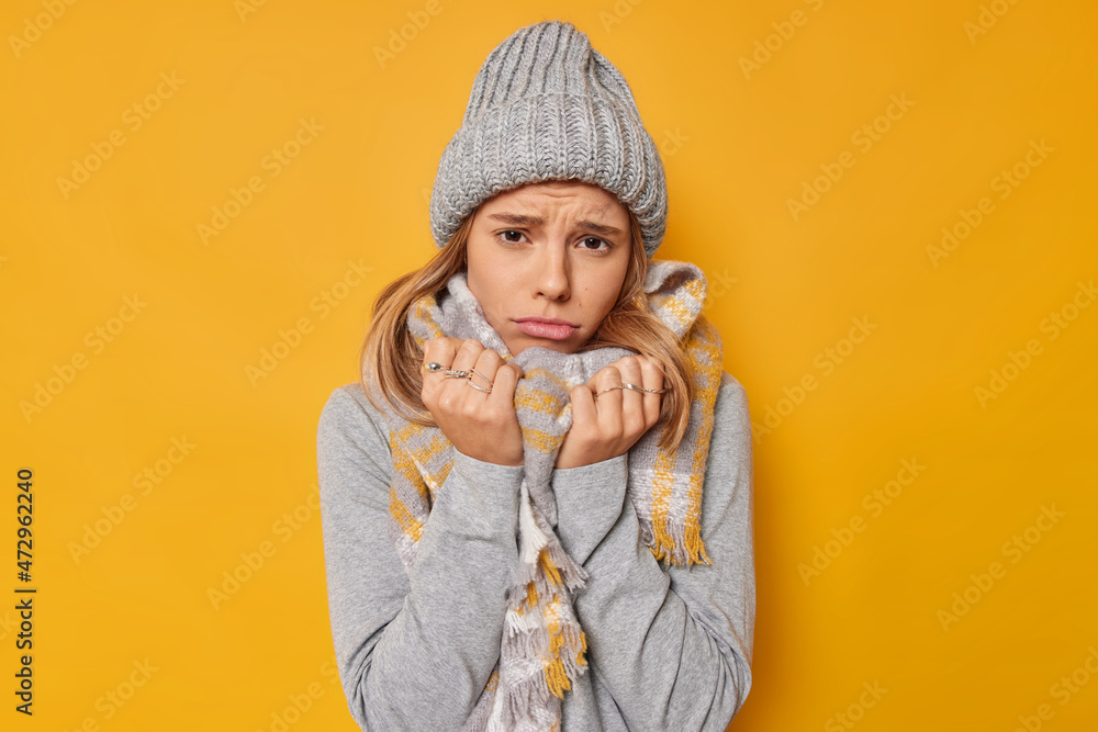Sad unhappy European woman looks with sulking expression has frowned ...