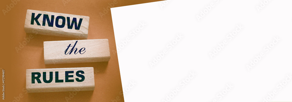 Know the rules word on wooden blocks isolated on dark grey background ...