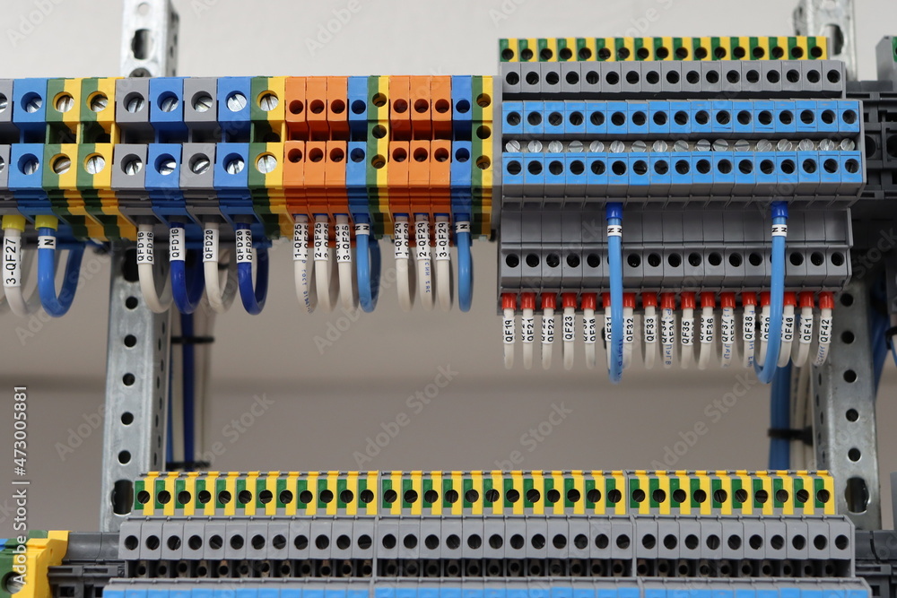 electrical terminals, mounted on a din rail. Connection by mounting ...