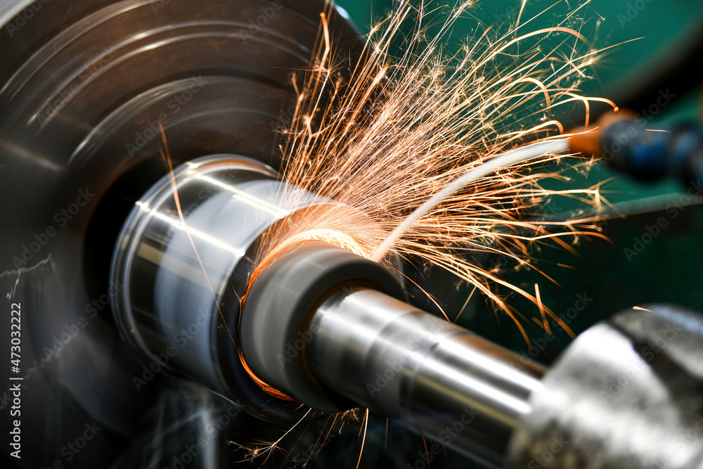 Grinding the hole of the part on a cylindrical grinding machine. Stock ...