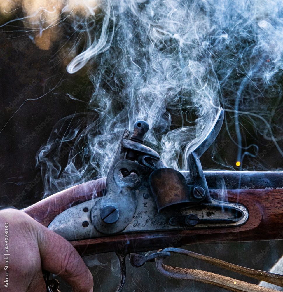flint lock black powder musket with spark and smoke Stock Photo | Adobe ...