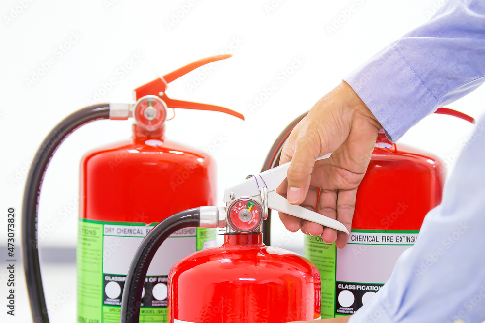 Fire extinguisher, Hand of engineer check handle and using fire ...