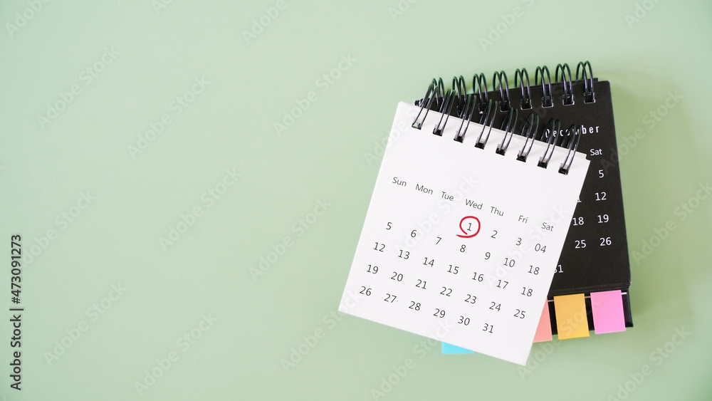 red marked on the 1st day of the month on opened white calendar on ...