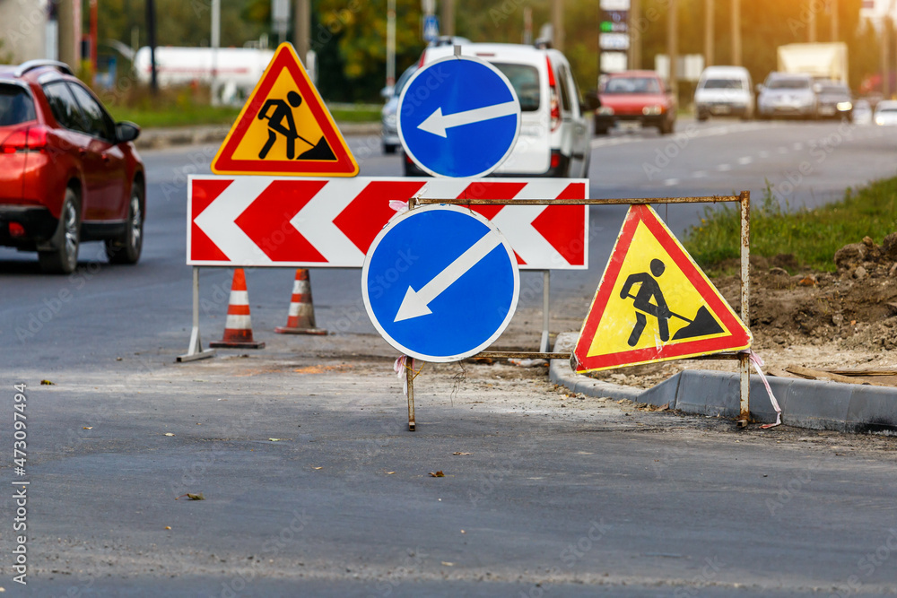 Road signs!Road works with trucks and traffic signs.road works road ...