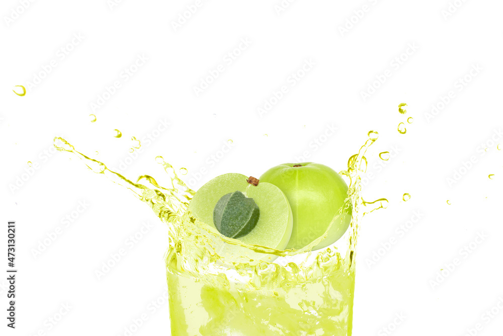 Glass of gooseberry juice with splash splash (phyllanthus emblica, Amla ...
