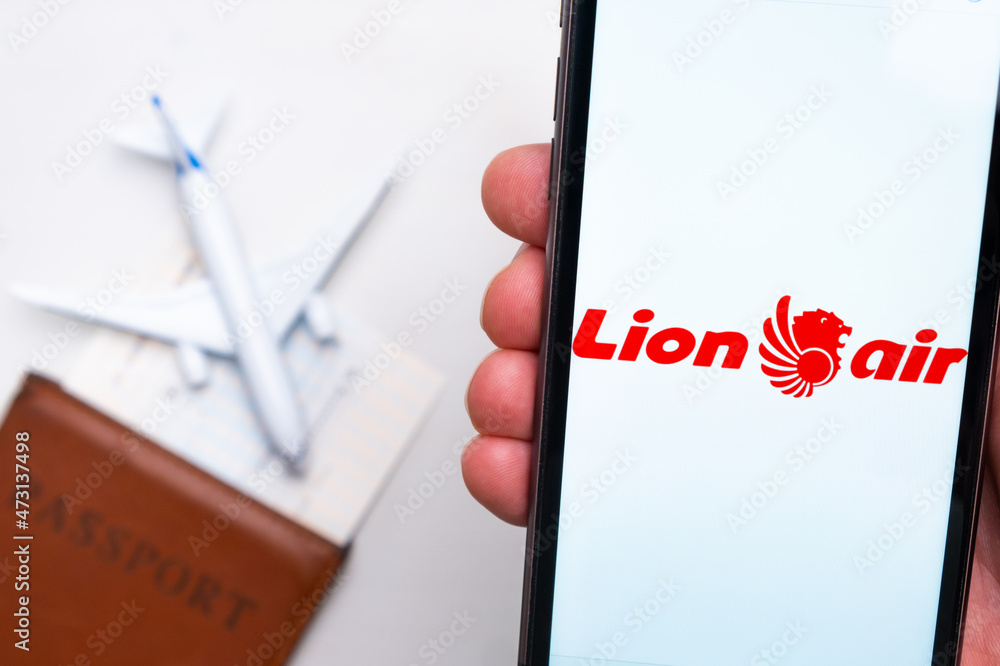 Lion Air Airline logo on the mobile phone screen with a plane, passport ...