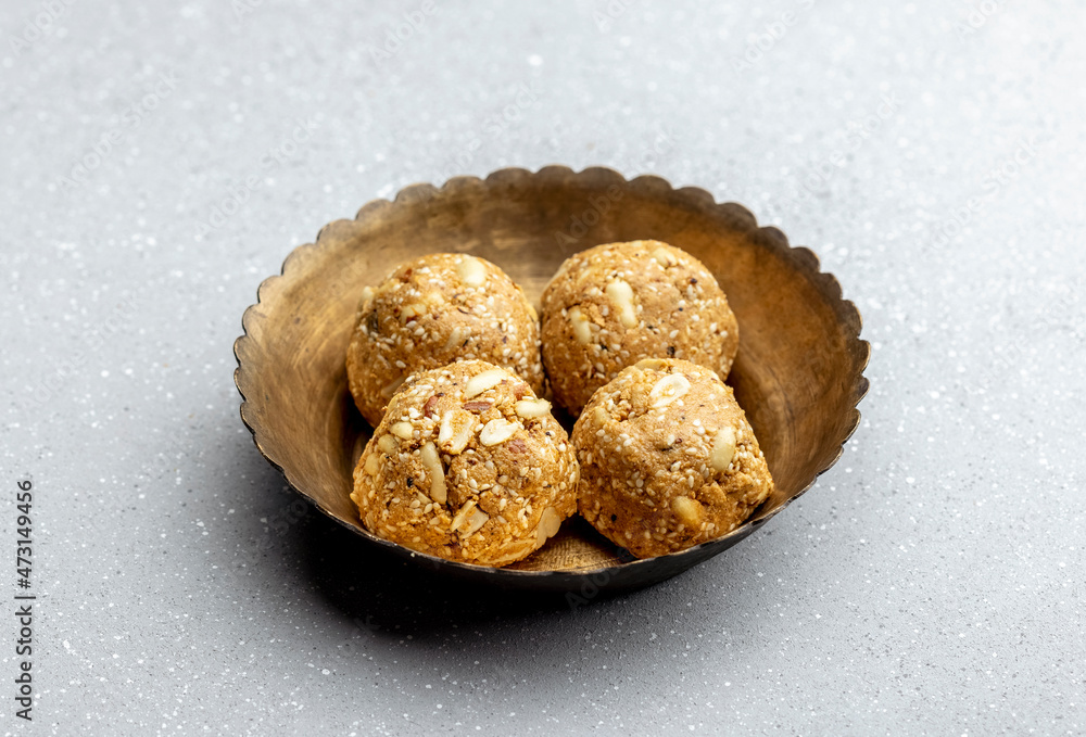 Gajak or til patti is a dry sweet cake - made of sesame seeds, ground ...