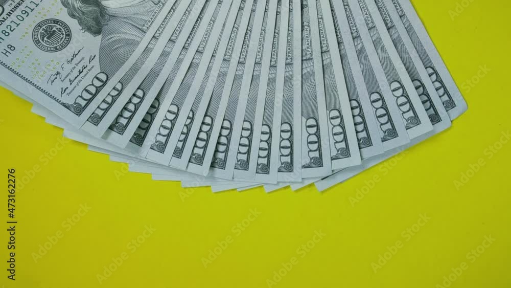 The dollar spin rotate quickly fast fly, dispart, splash to the sides ...