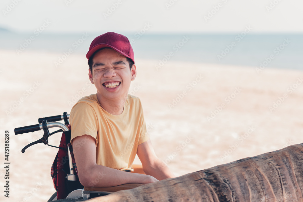 Young man with disability with happy face on the sea beach in vacation ...