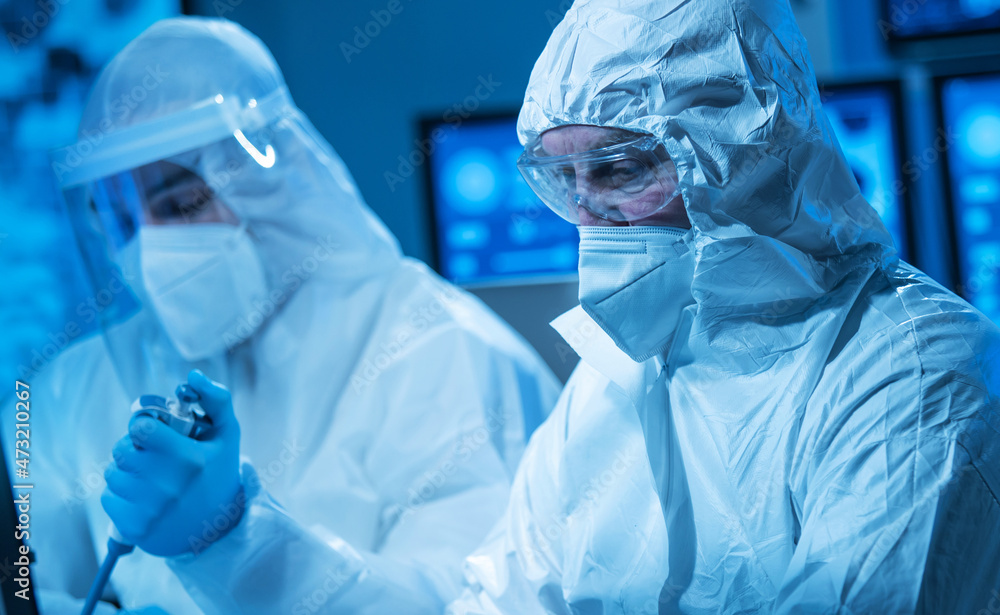 Scientists work in a modern scientific lab using laboratory equipment ...