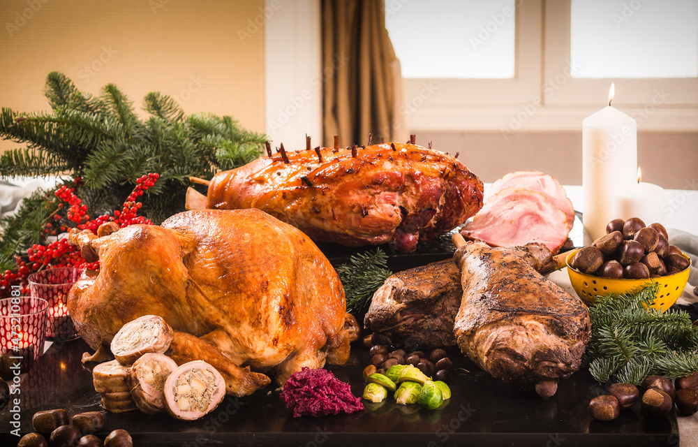 Festive Platter of whole roasted turkey, glazed ham hock and leg of ...