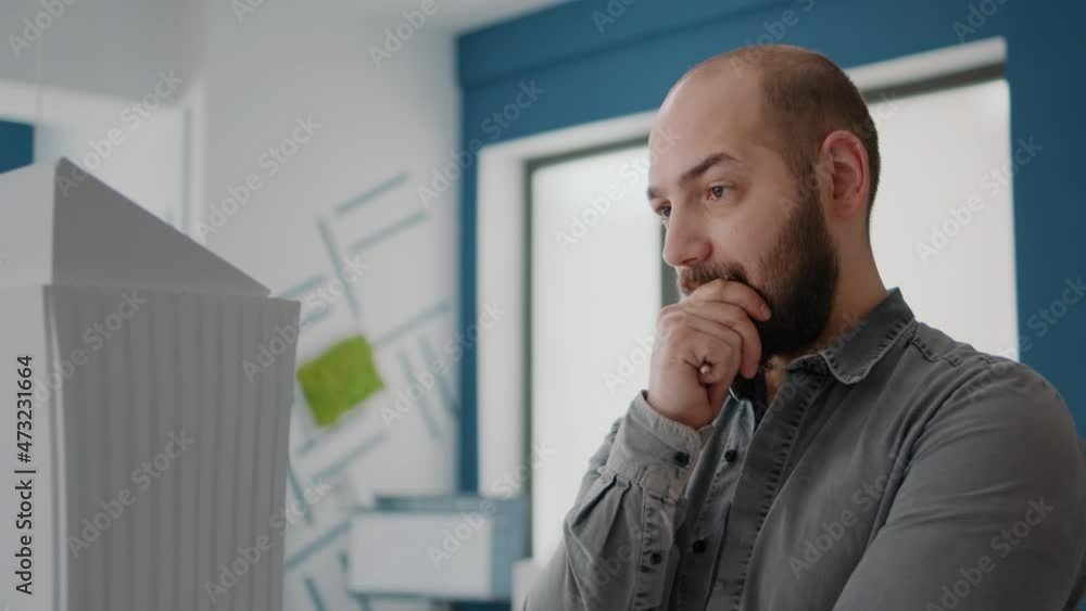 Close up of architect thinking about building strategy for construction ...