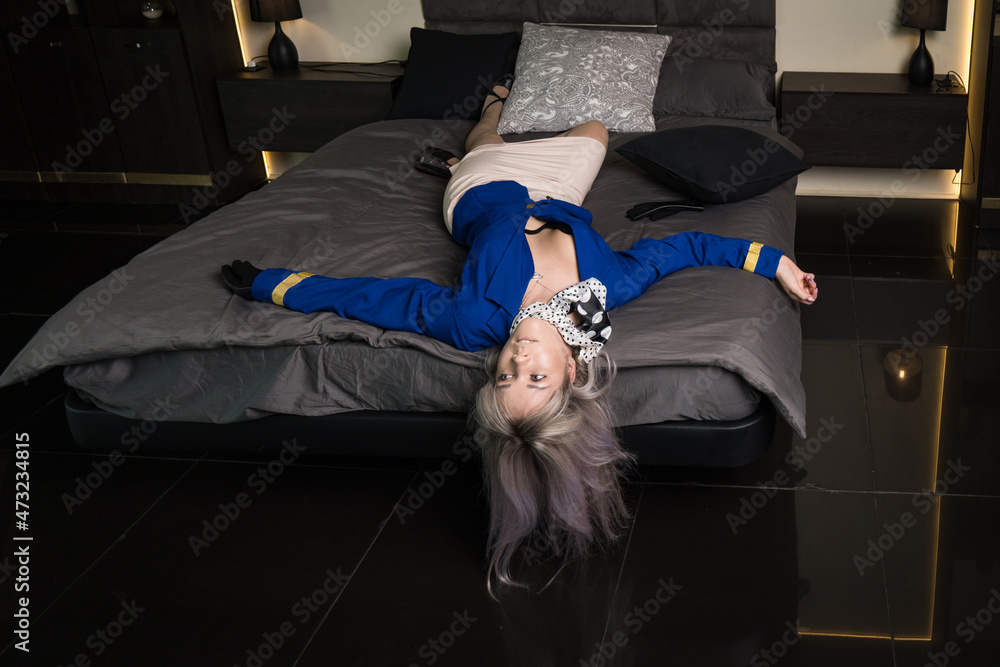 Noir film. Young beautiful flight attendant in uniform being strangled. Not contain any logos or ...