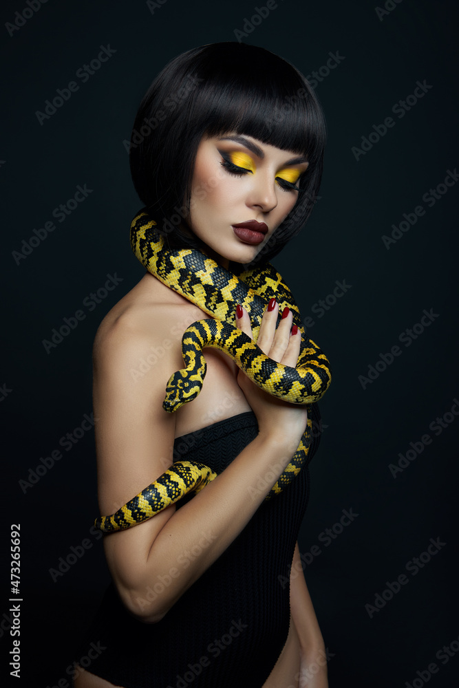 Beauty woman short haircut python yellow snake on her neck. A yellow ...