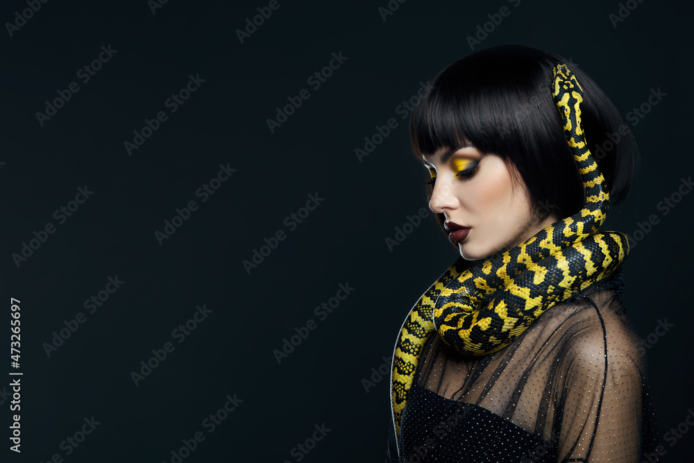 Beauty woman short haircut python yellow snake on her neck. A yellow ...