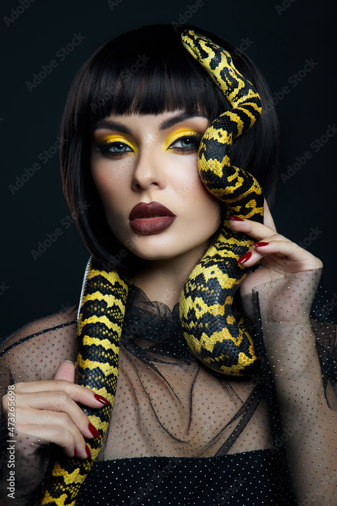 Beauty woman short haircut python yellow snake on her neck. A yellow ...