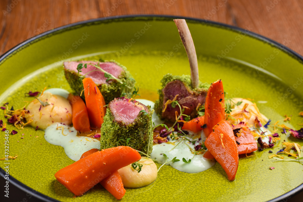 Fine dining, roasted Lamb chops with potato, rosemary and vegetable ...