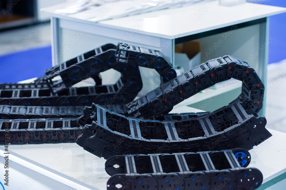 Plastic cable chain of electrical wires in the machine. An example of a ...