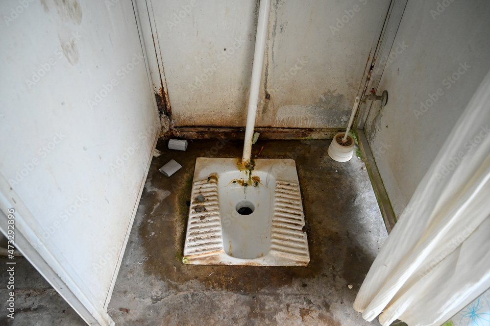 Dirty toilet in house. Unhygienic and neglected public rest-room ...