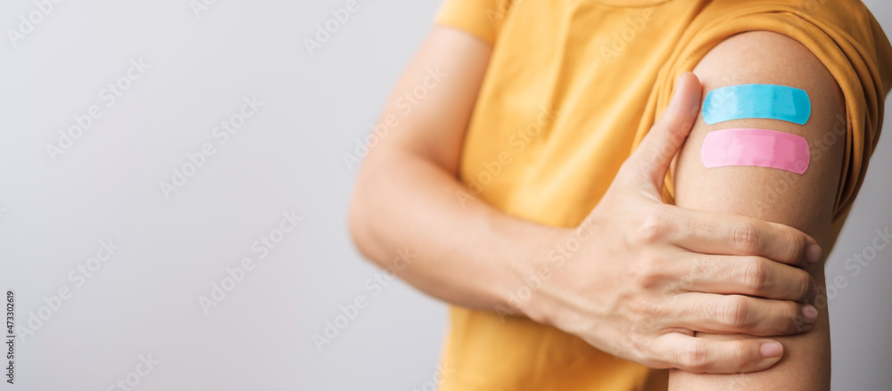 woman showing plaster after receiving covid 19 vaccine. Vaccination ...
