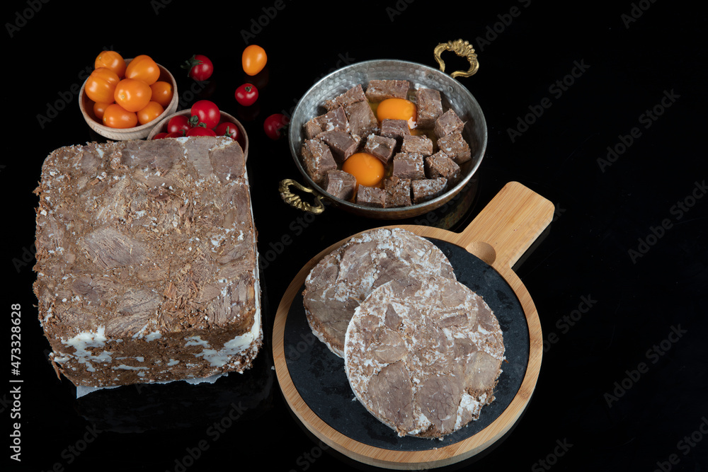 Turkish roasted meat ( kavurma ) on wooden table. Turkish cuisine; eggs ...