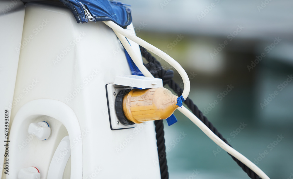 Electrical power socket bollard on pier. Charging station for boats in ...
