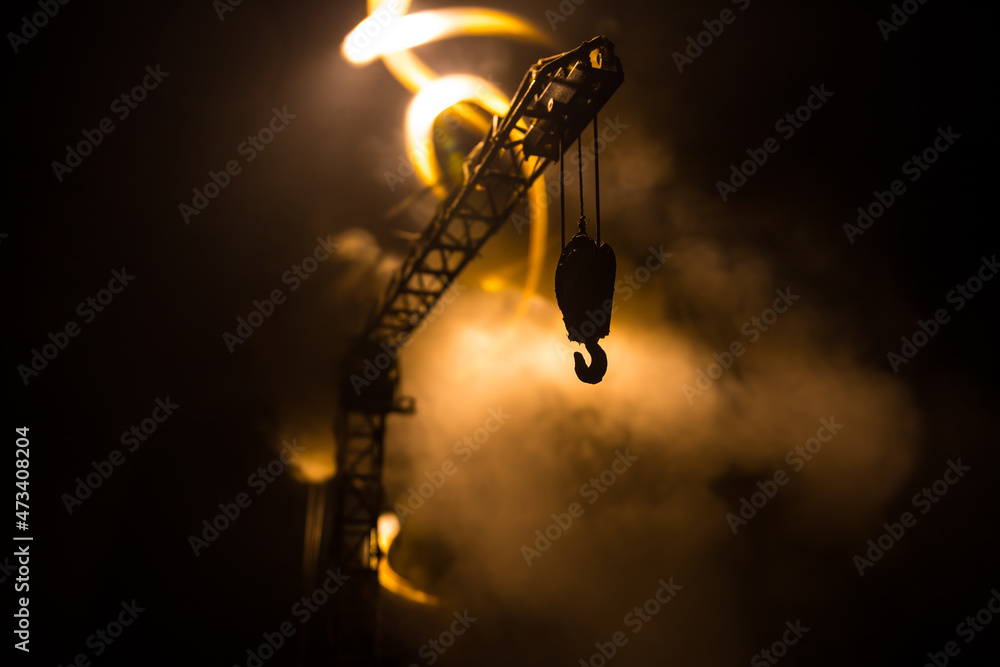 Abstract Industrial background with construction crane silhouette over ...