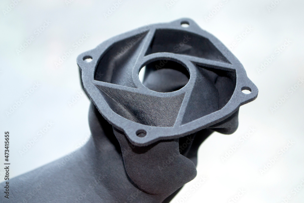 Person holding object printed on powder 3D printer from powder ...