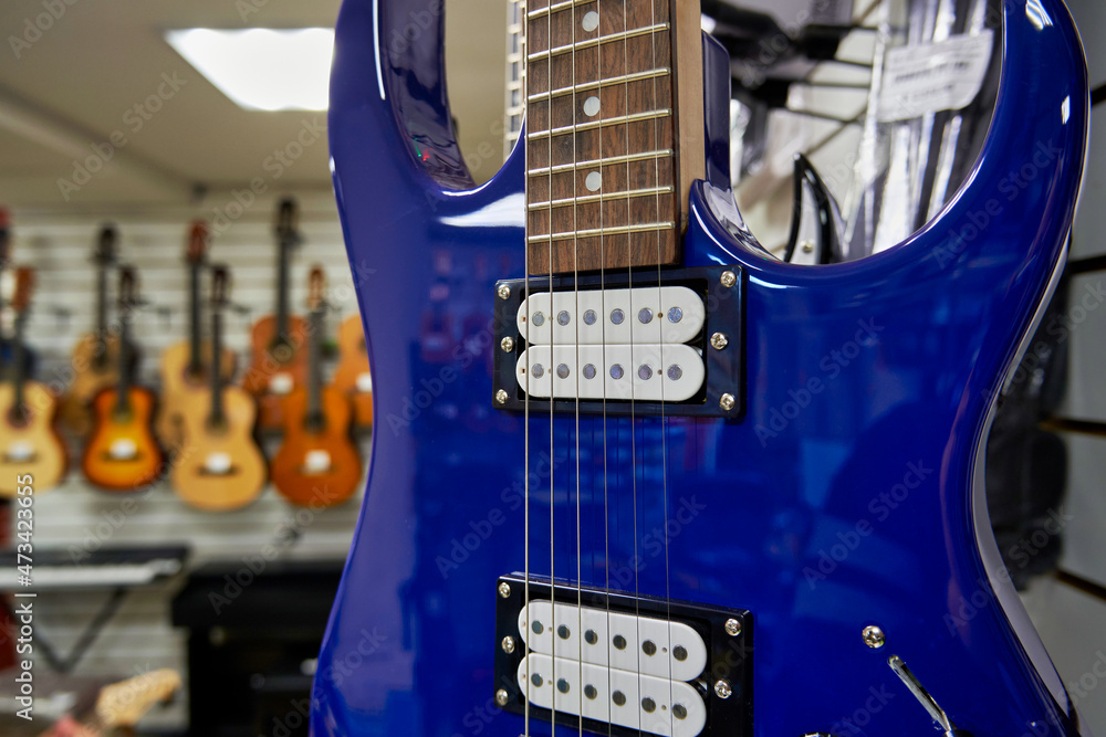 Blue electric guitar in a guitar shop close up Stock Photo | Adobe Stock