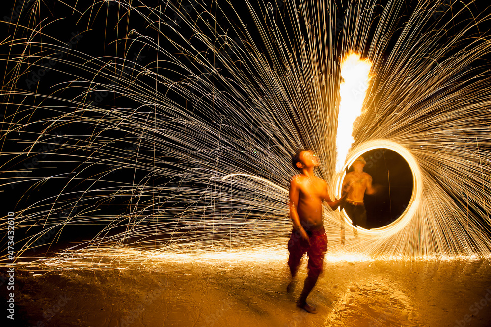 Fire dancer performing on the beach in Railay Stock Photo | Adobe Stock