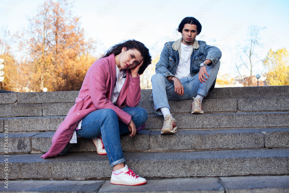 young happy students teenagers at university building on stairs ...
